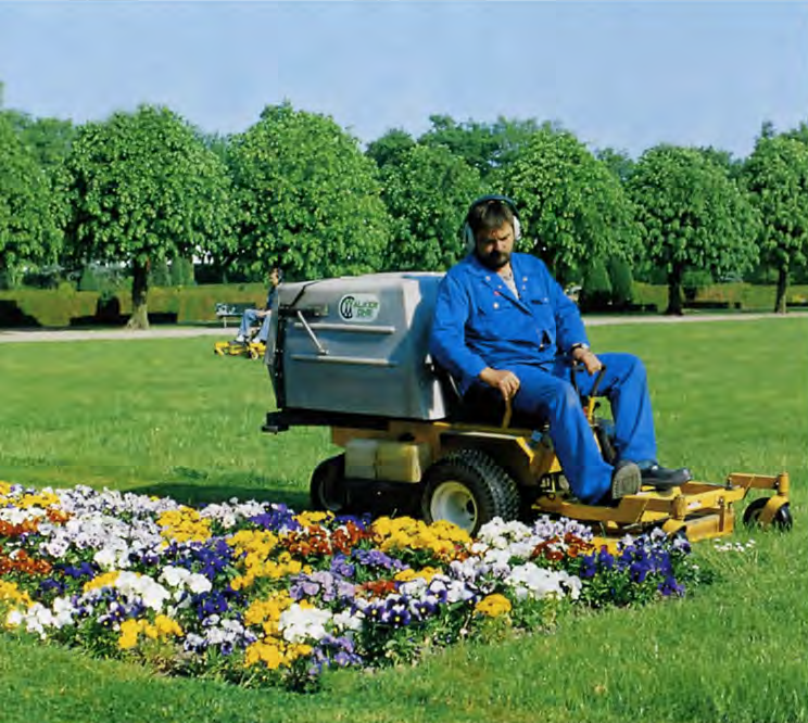 Mowers contain grass - and weeds - in cemetery